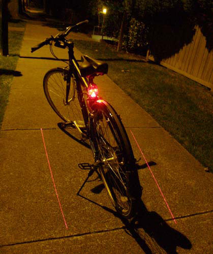Bike light with laser cannon creates a glowing, personal bike-lane ...
