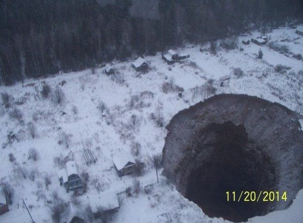 Photo of a monstrous hole swallowing a neighborhood - Boing Boing