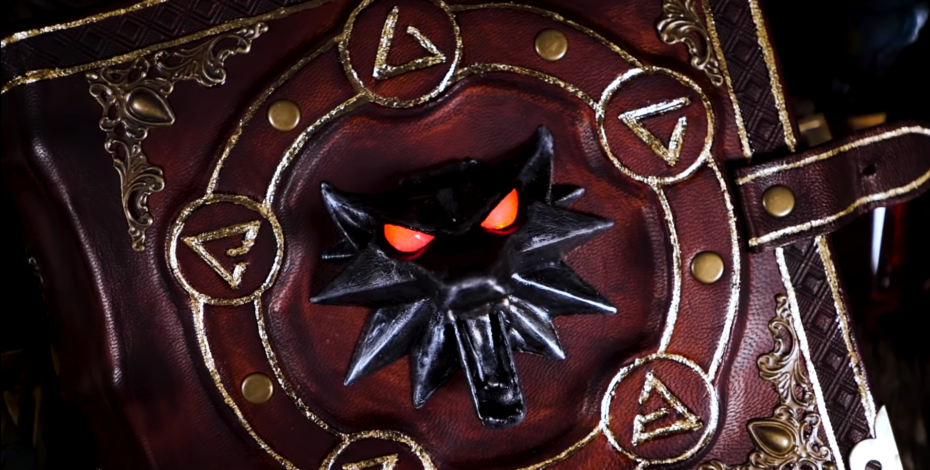 Nerdforge binds a leather book with an electrified Witcher sigil on the ...
